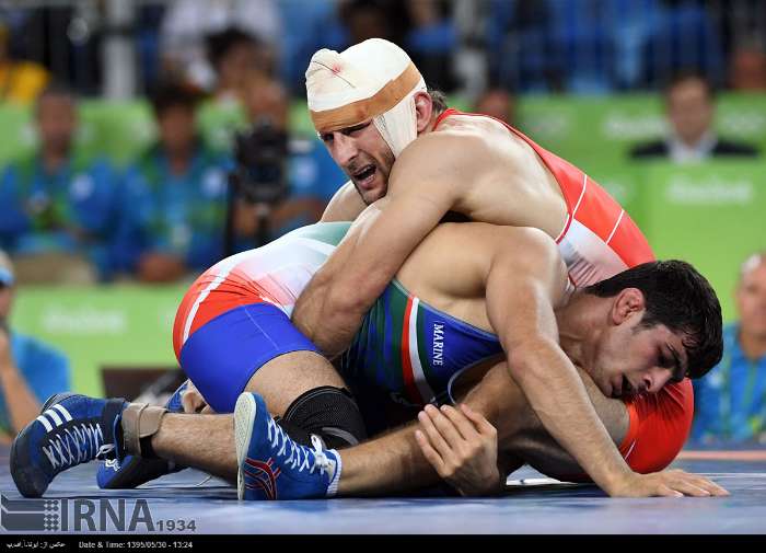 IRNA English - Iranian freestyle wrestler wins gold medal in Olympics