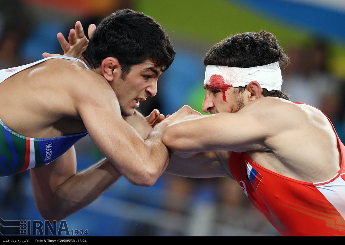 IRNA English - Iranian freestyle wrestler wins gold medal in Olympics