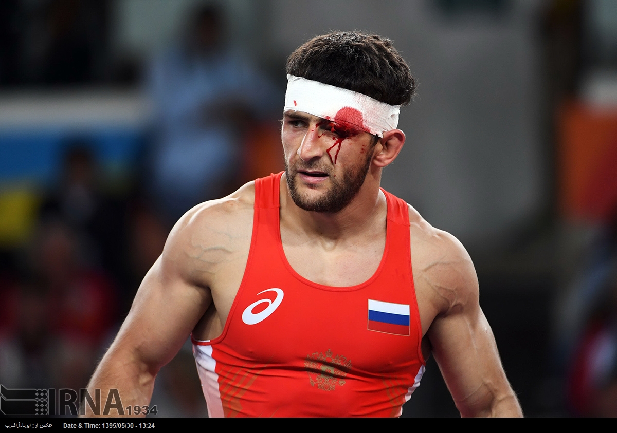 IRNA English - Iranian freestyle wrestler wins gold medal in Olympics