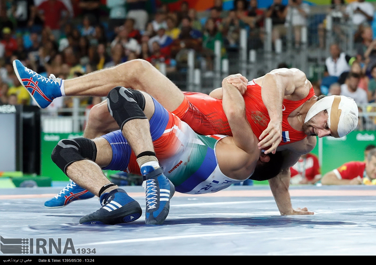 IRNA English - Iranian freestyle wrestler wins gold medal in Olympics