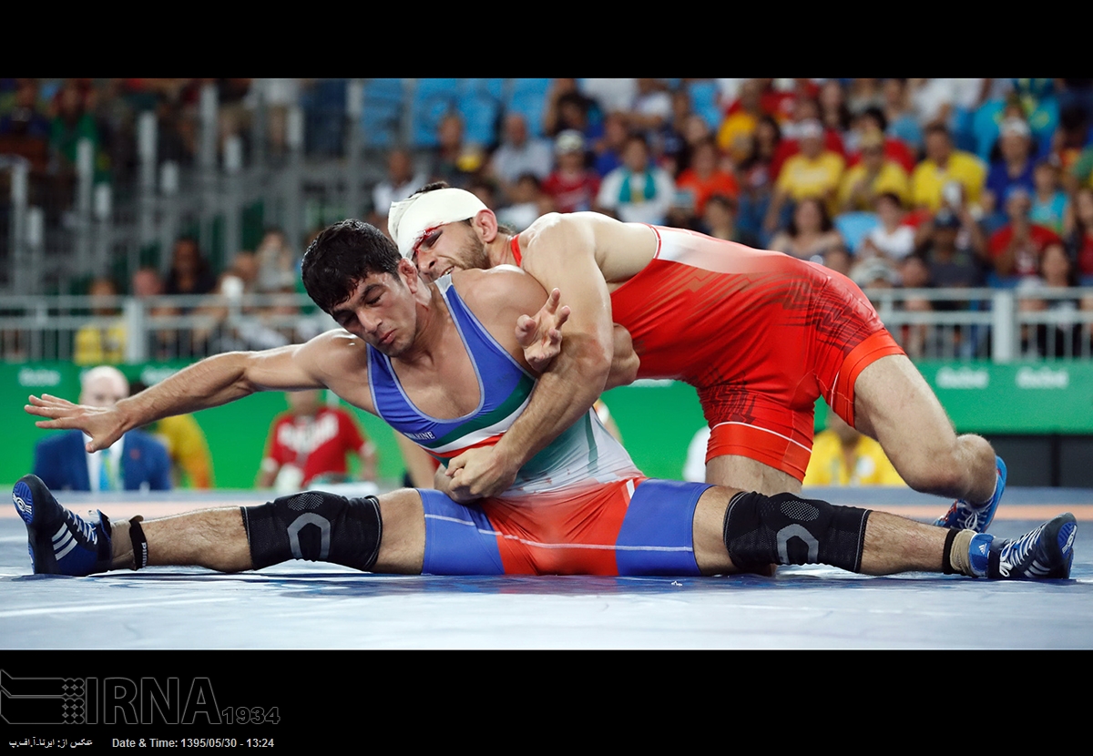 IRNA English - Iranian freestyle wrestler wins gold medal in Olympics
