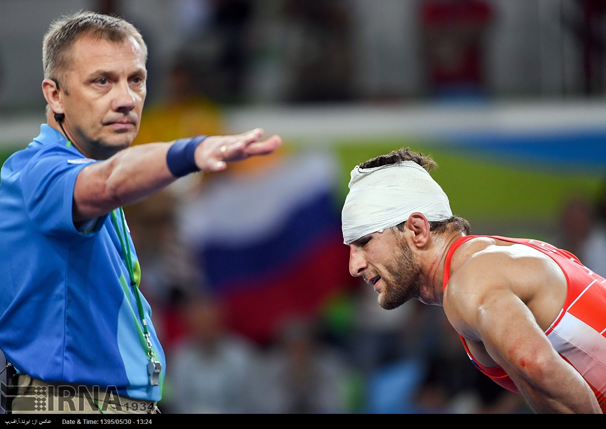 IRNA English - Iranian freestyle wrestler wins gold medal in Olympics