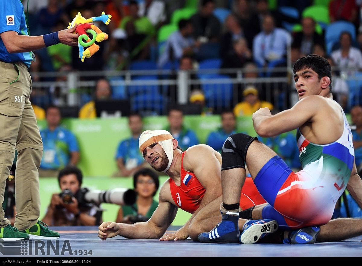 IRNA English - Iranian freestyle wrestler wins gold medal in Olympics