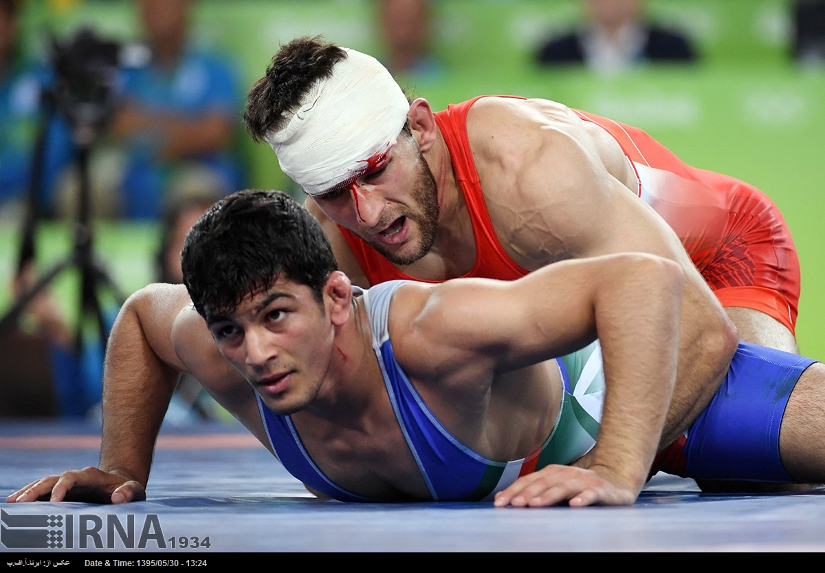 IRNA English - Iranian freestyle wrestler wins gold medal in Olympics