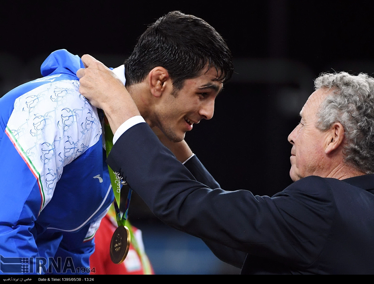 IRNA English - Iranian freestyle wrestler wins gold medal in Olympics