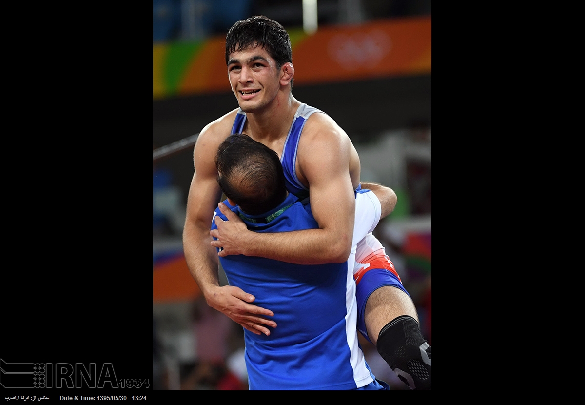 IRNA English - Iranian freestyle wrestler wins gold medal in Olympics