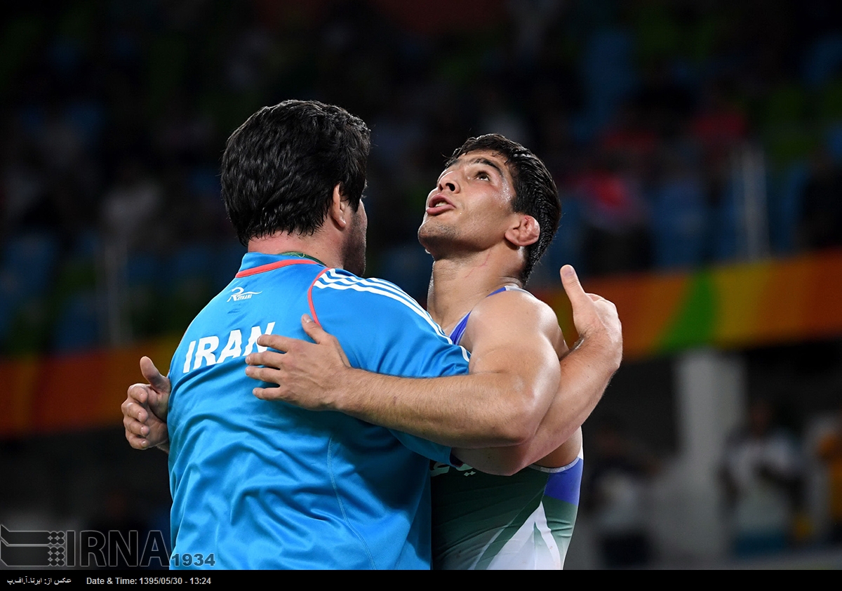 IRNA English - Iranian freestyle wrestler wins gold medal in Olympics