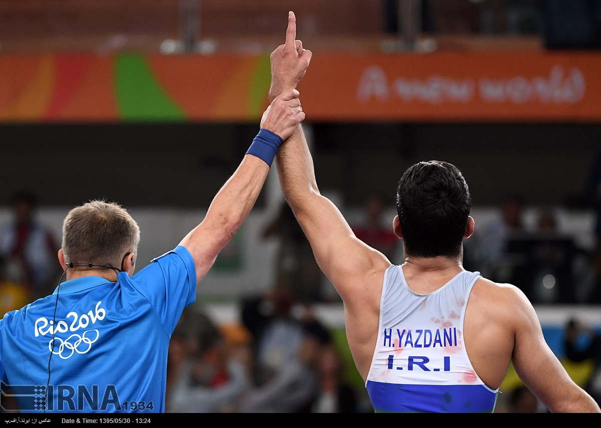 IRNA English - Iranian freestyle wrestler wins gold medal in Olympics
