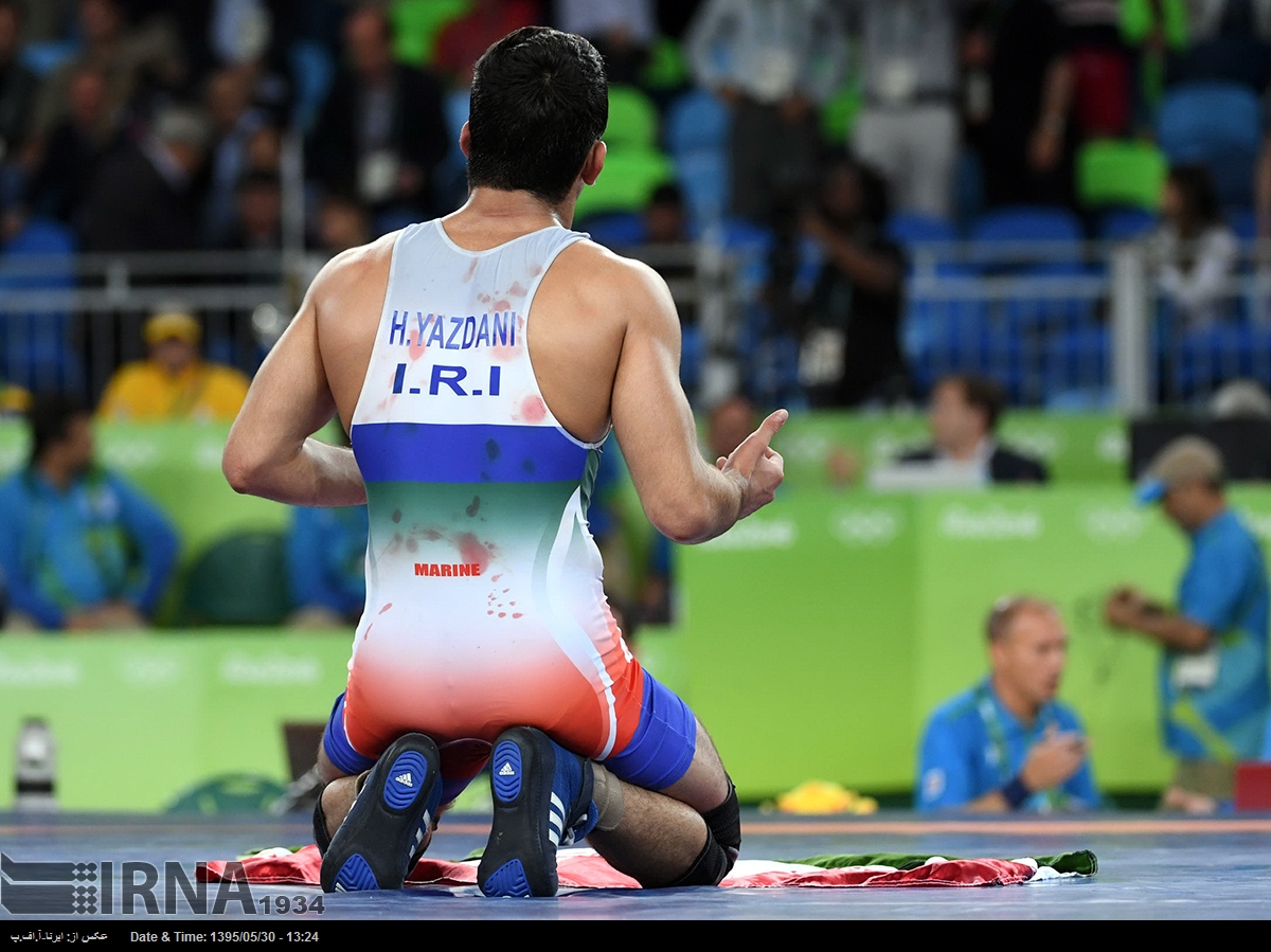 IRNA English - Iranian freestyle wrestler wins gold medal in Olympics
