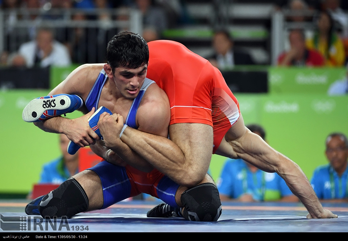 IRNA English - Iranian freestyle wrestler wins gold medal in Olympics